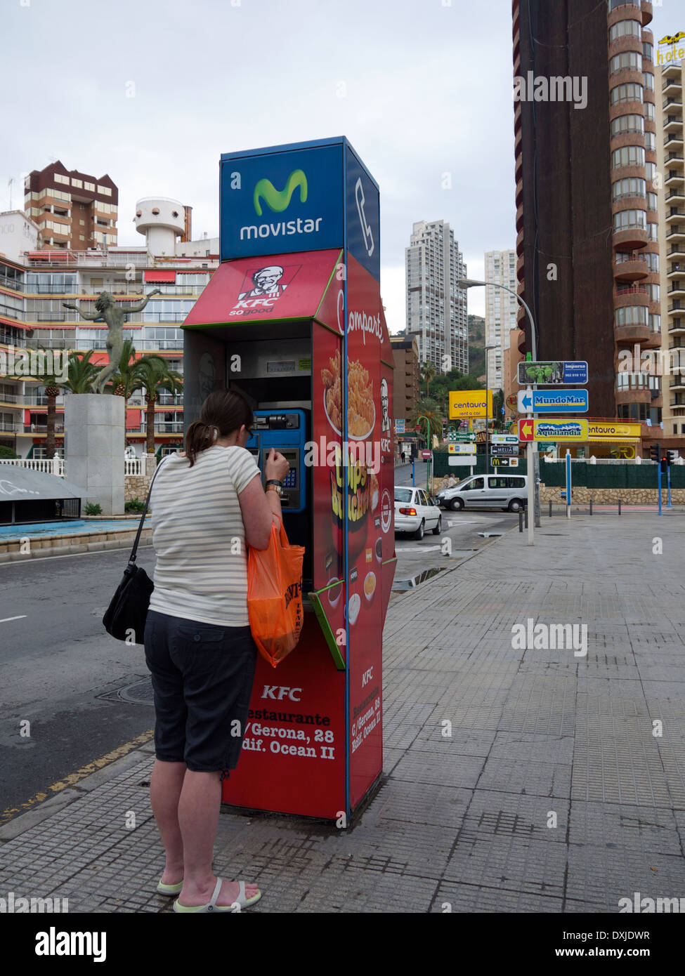 Lady on a public telephone in Spain Stock Photo - Alamy