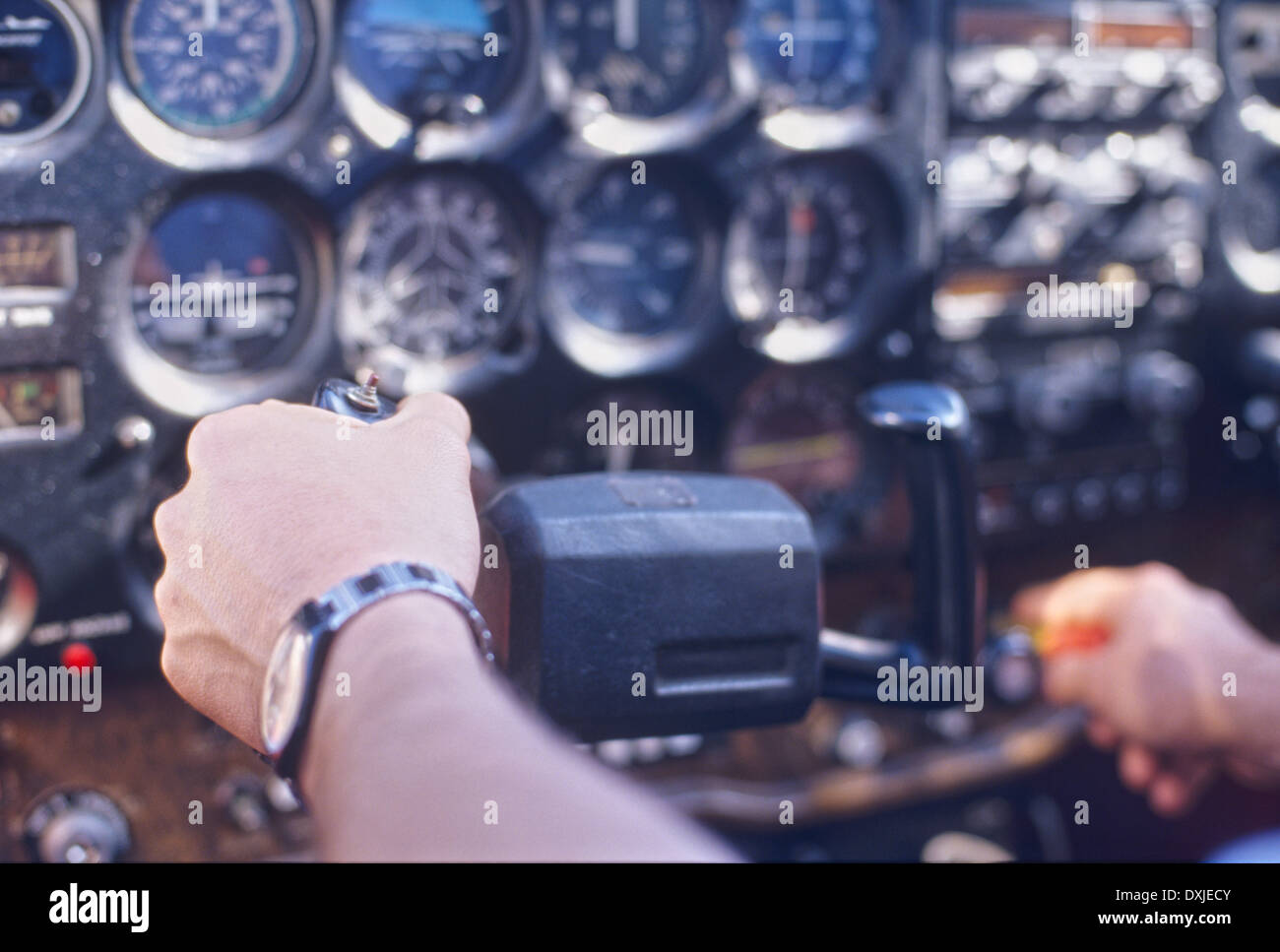 Pilot handling controls close-up (focus on hand Stock Photo - Alamy