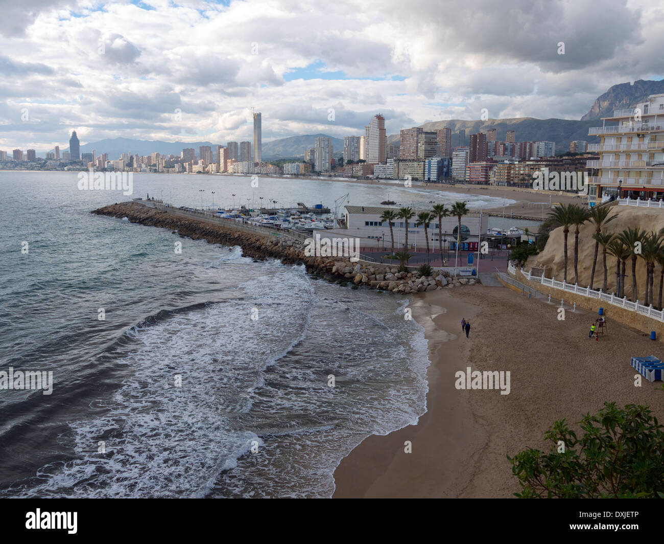Beach and harbor and city in the background in Benidorm, Spain Stock ...