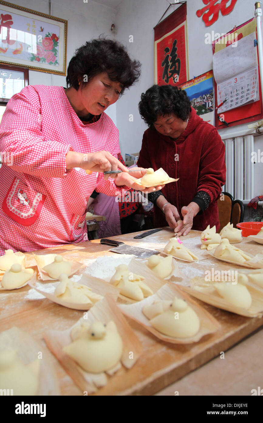 Weihai, China's Shandong Province. 27th Mar, 2014. Local women make ...