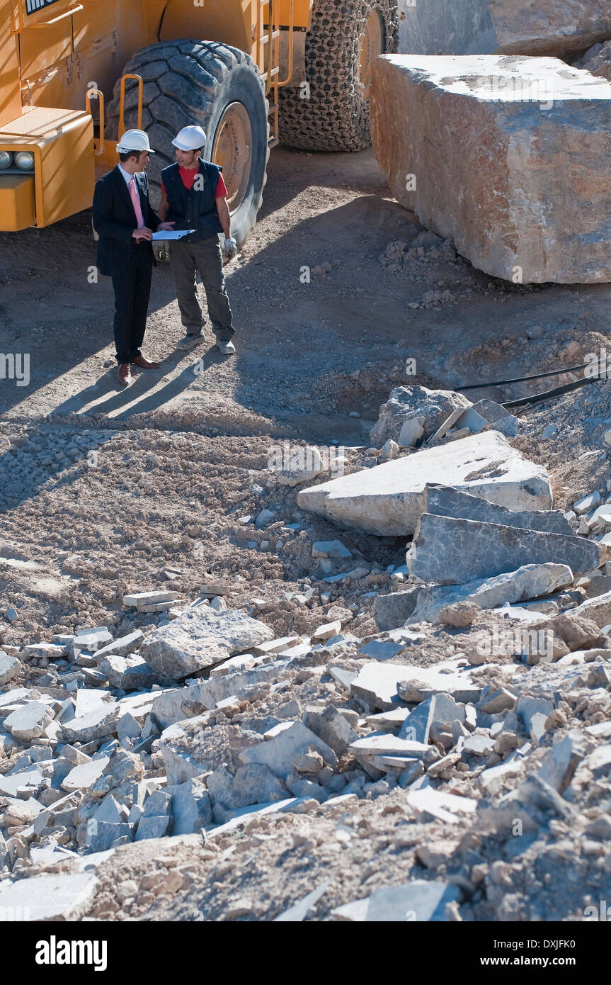 manager and worker in marble quarry Stock Photo - Alamy