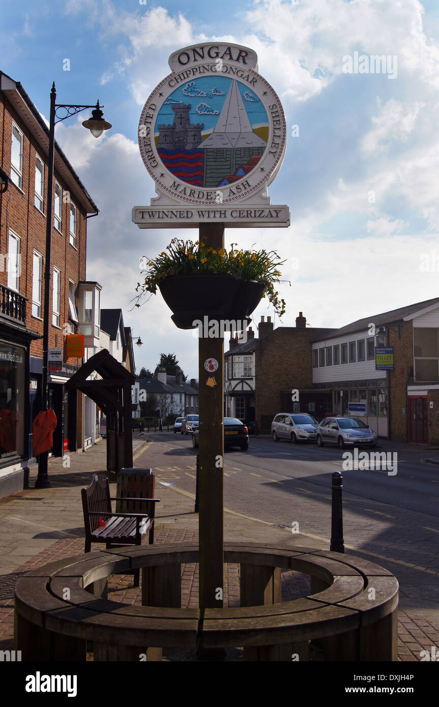 Town sign with coat of arms showing castle and church Chipping Ongar ...