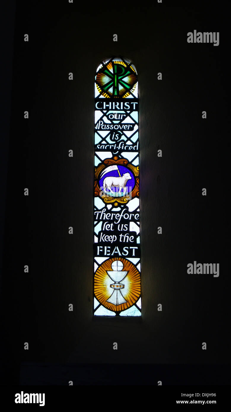 Stained glass in a Norman lancet window showing the agnus dei, St ...