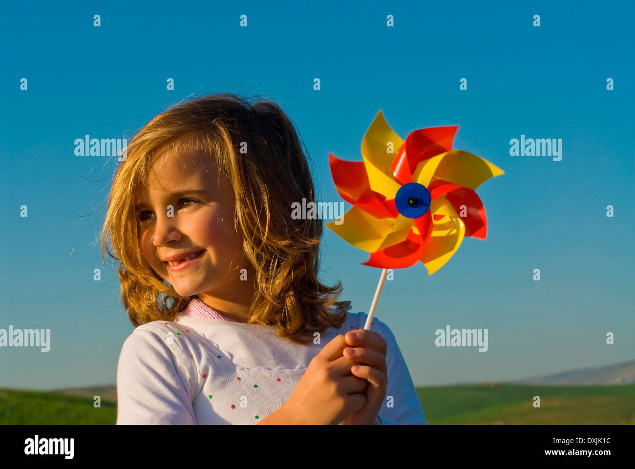 Girl in field toy hi-res stock photography and images - Alamy