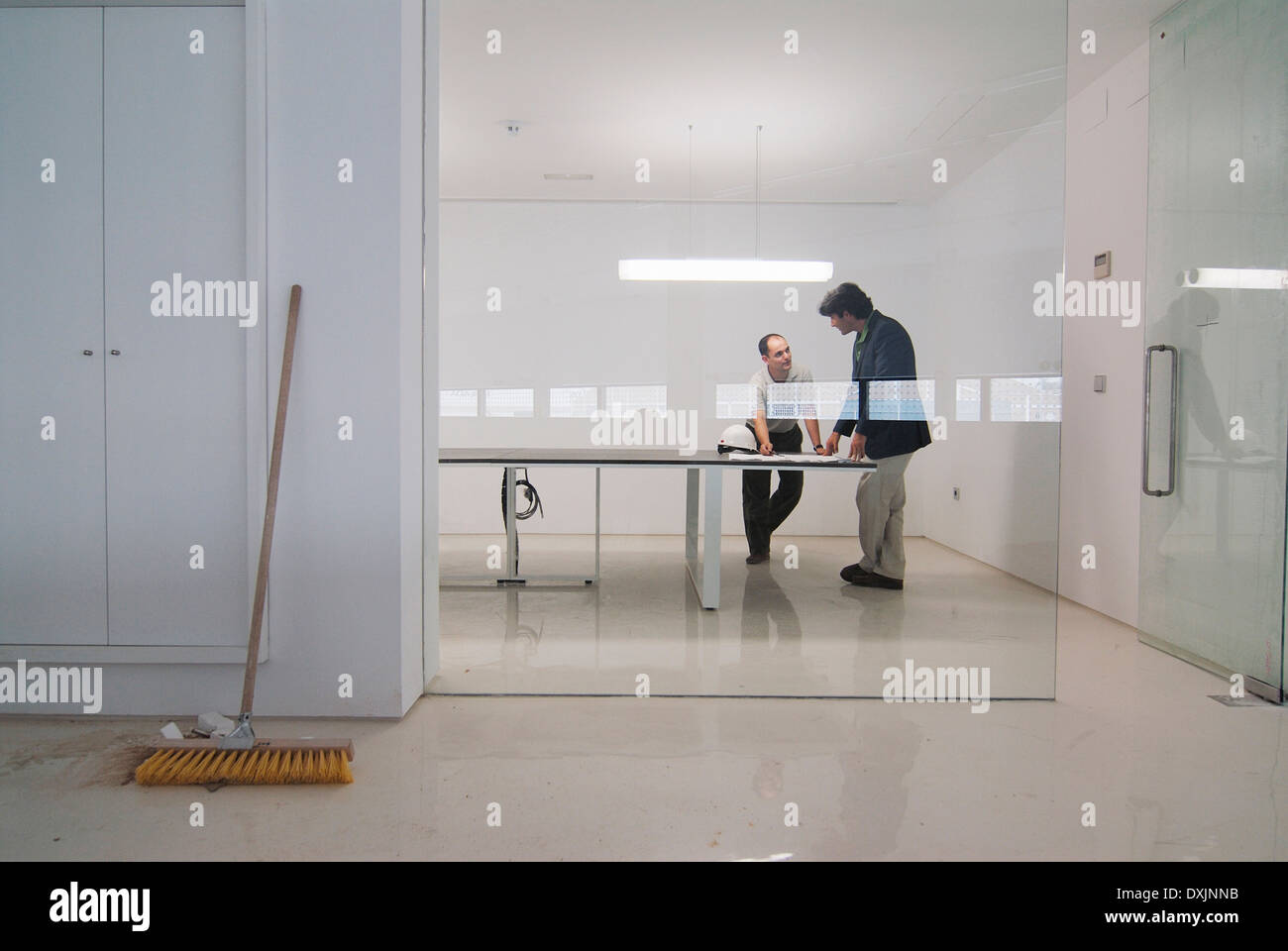 Two men in conference room of new office Stock Photo - Alamy
