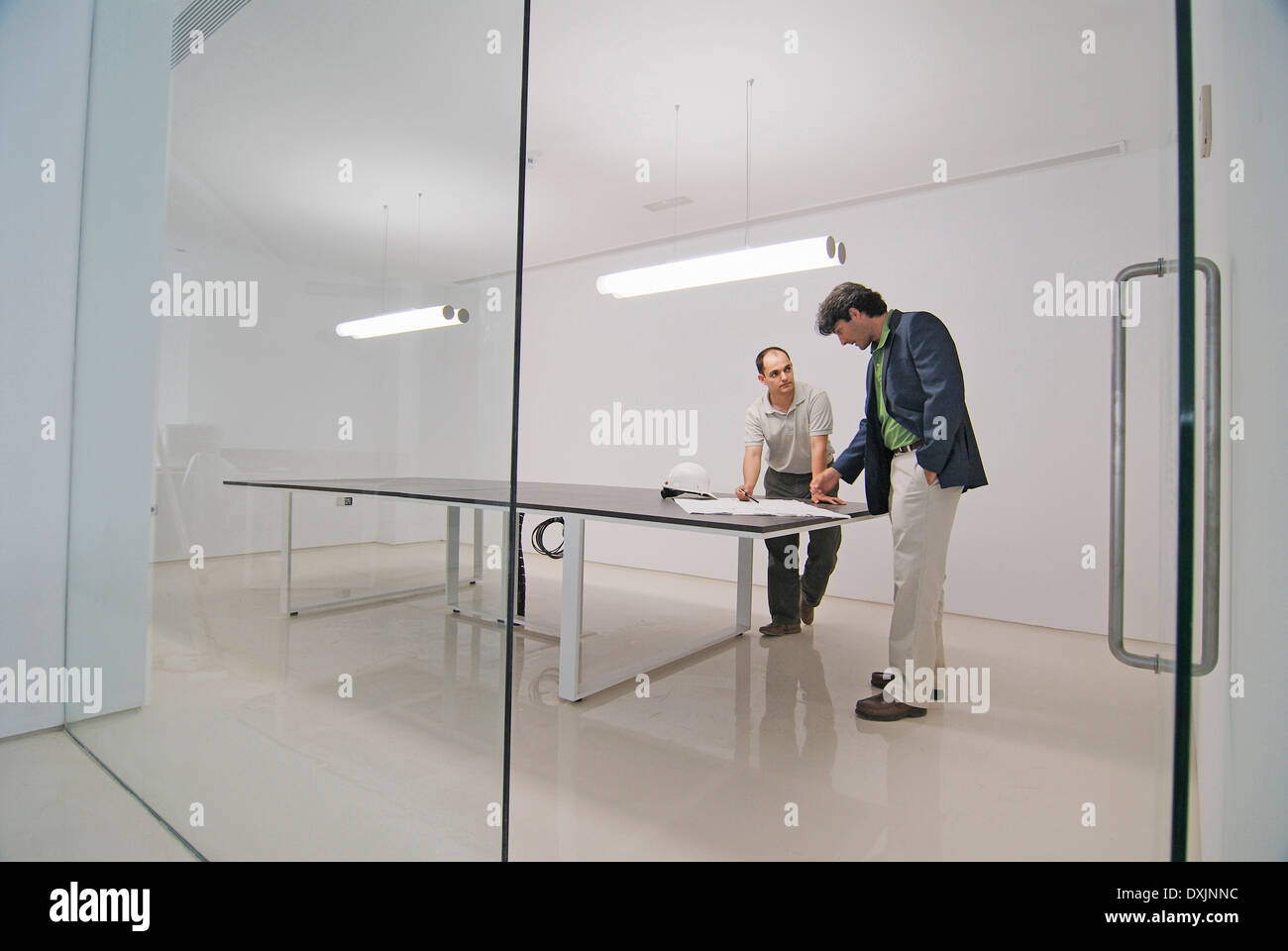 Two men in conference room of new office Stock Photo - Alamy
