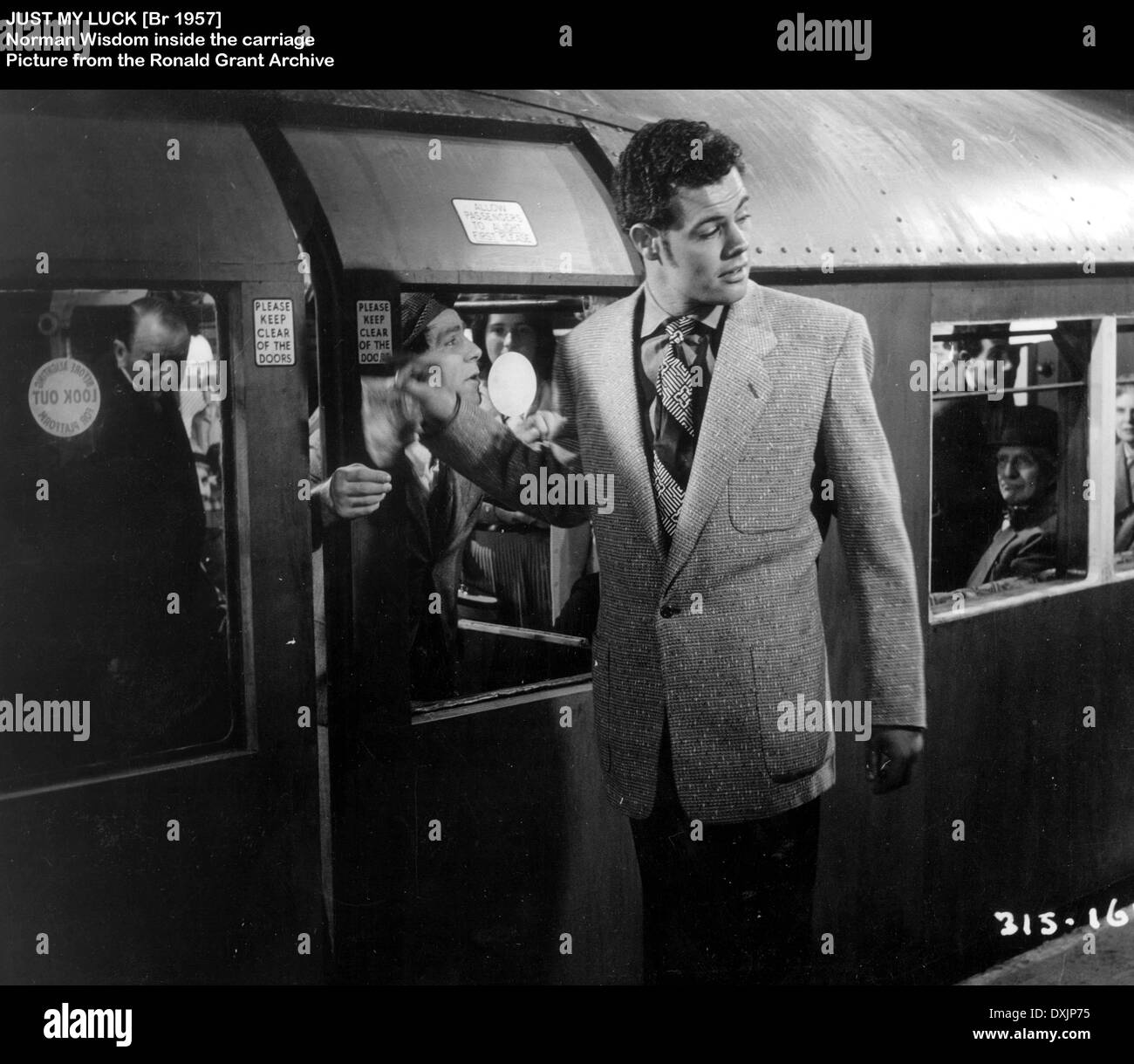 Norman wisdom 1957 hi-res stock photography and images - Alamy