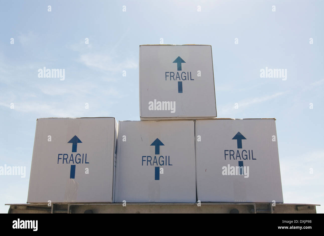 Removal boxes piled on crate low angle Stock Photo - Alamy