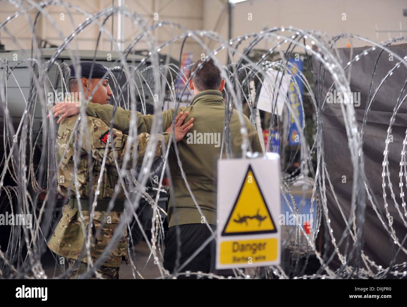 Royal Military Police searching a prisoner in a temporary detention ...