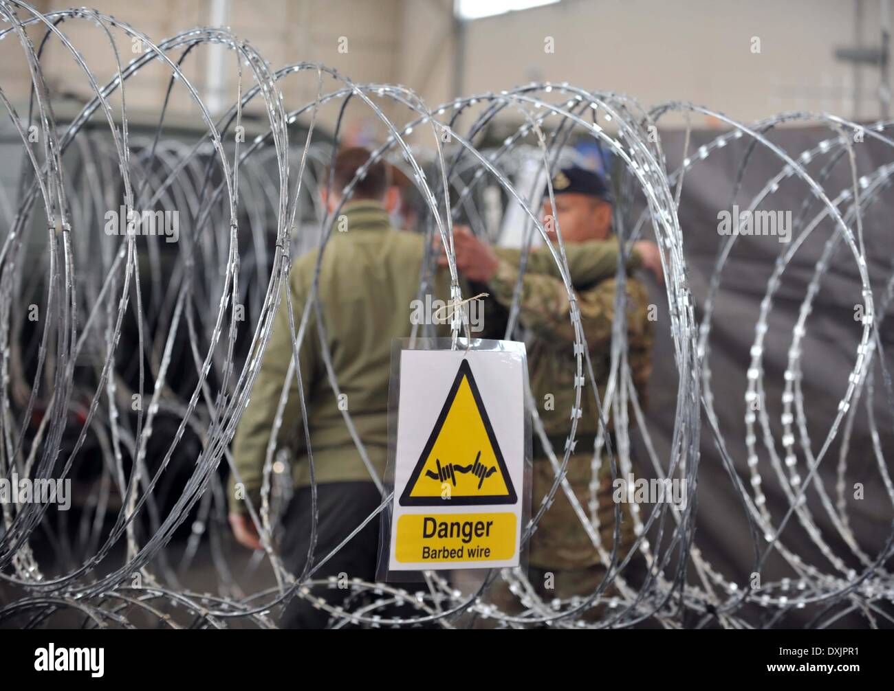 Royal Military Police searching a prisoner in a temporary detention ...