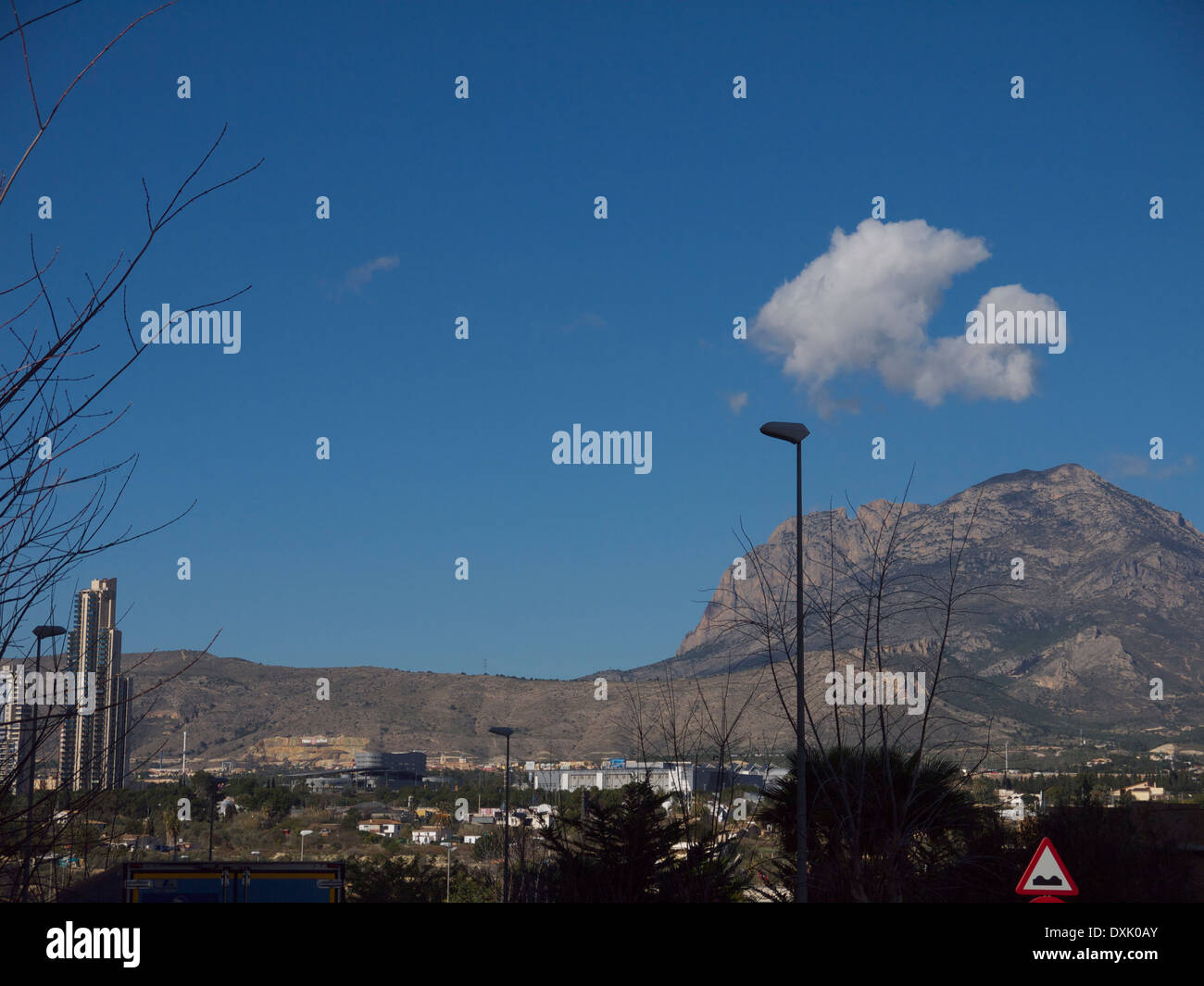 Mountain with a cloud above it in Benidorm, Spain Stock Photo - Alamy