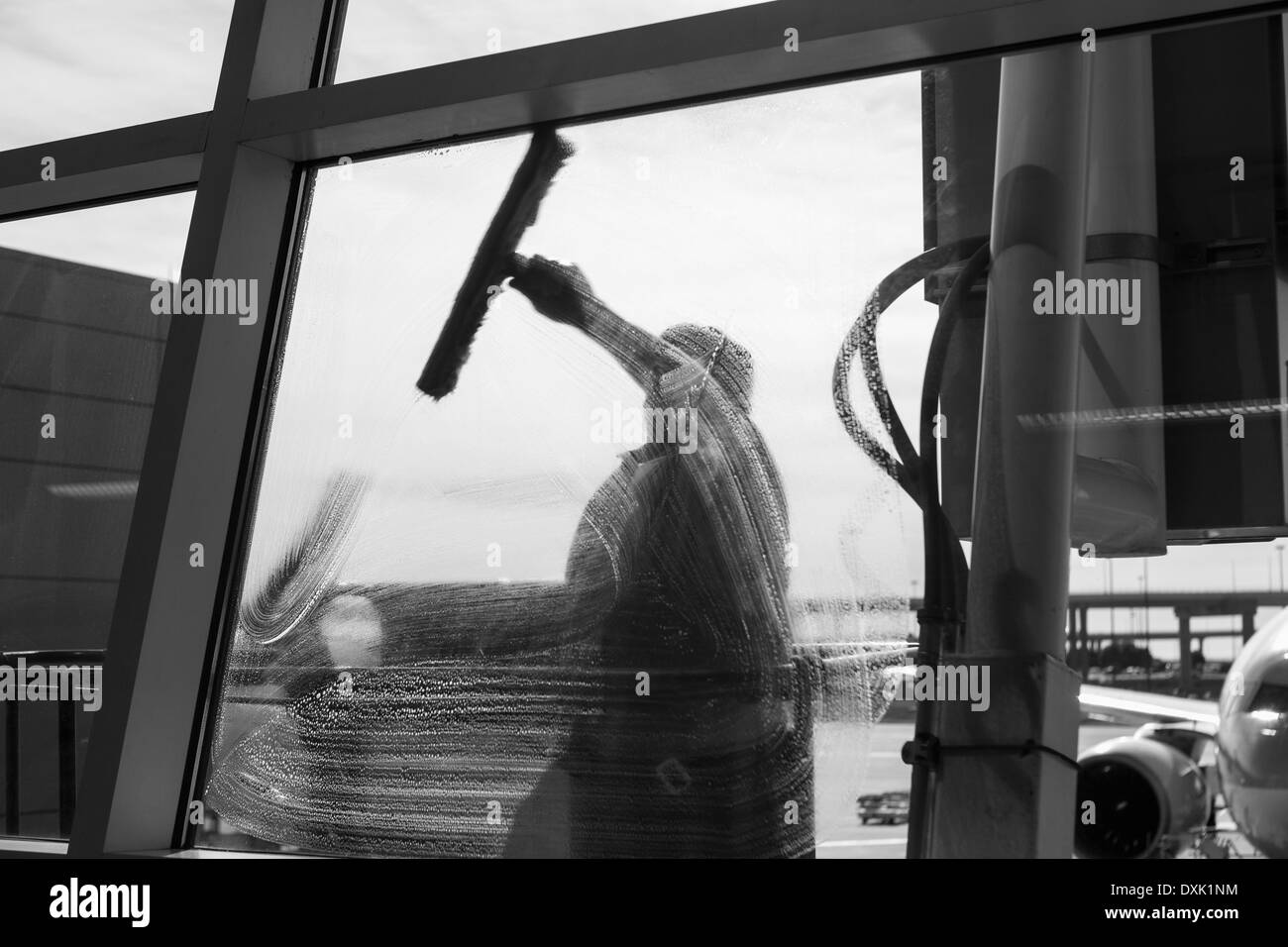 Window washer cleaning window Stock Photo - Alamy