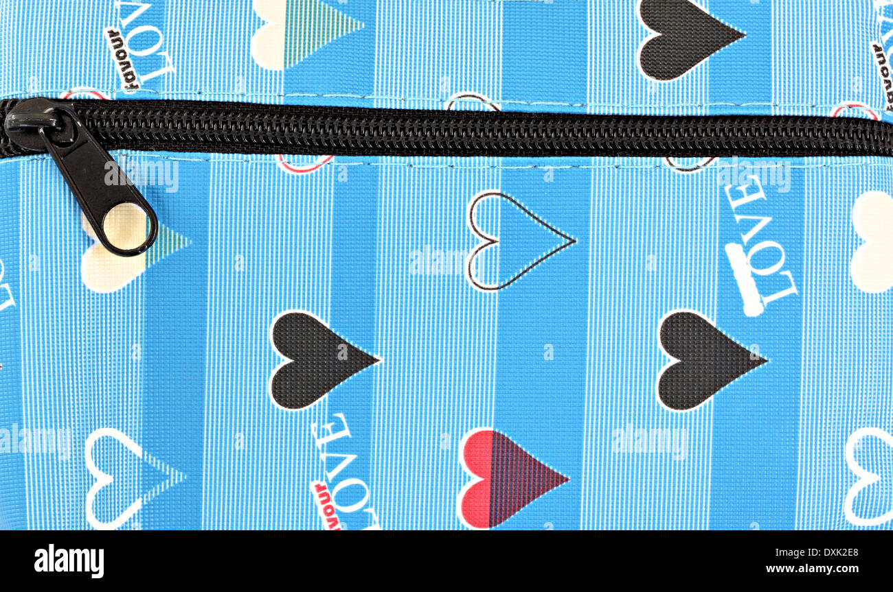 Heart pattern and top zip on wallet for background Stock Photo - Alamy