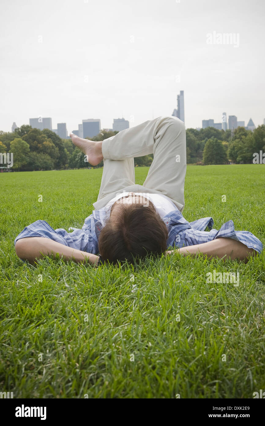 Man laying in urban park hi-res stock photography and images - Alamy