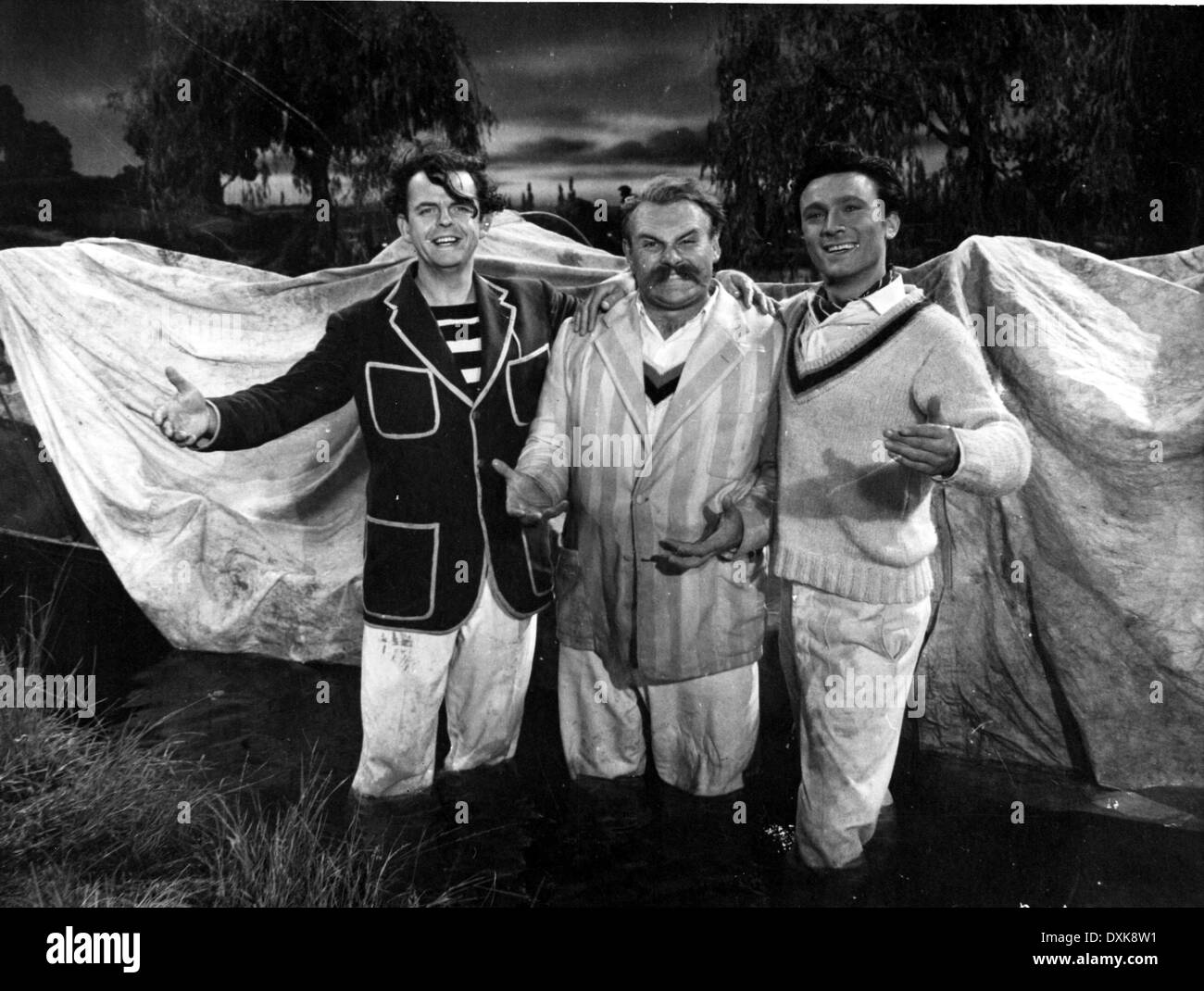 THREE MEN IN A BOAT Stock Photo - Alamy