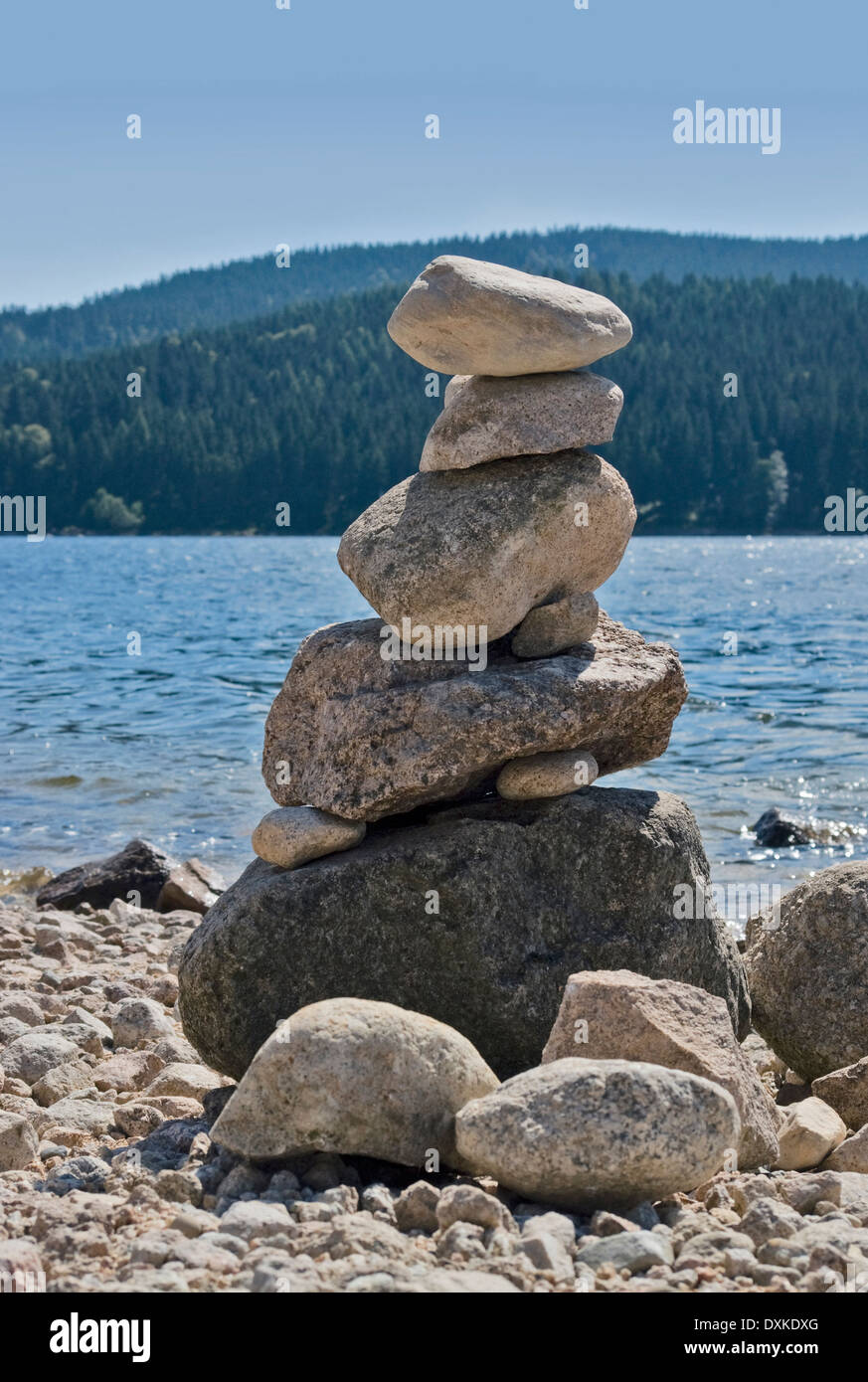 sunny illuminated pebble pile at the Schluchsee in the Black Forest ...