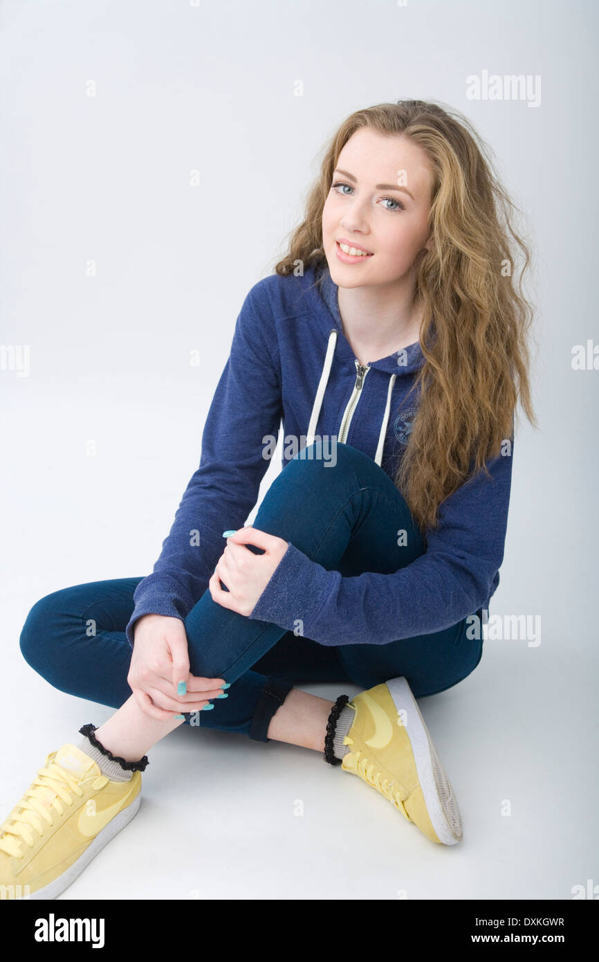 Teenage girl sitting crossed legged hi-res stock photography and images ...