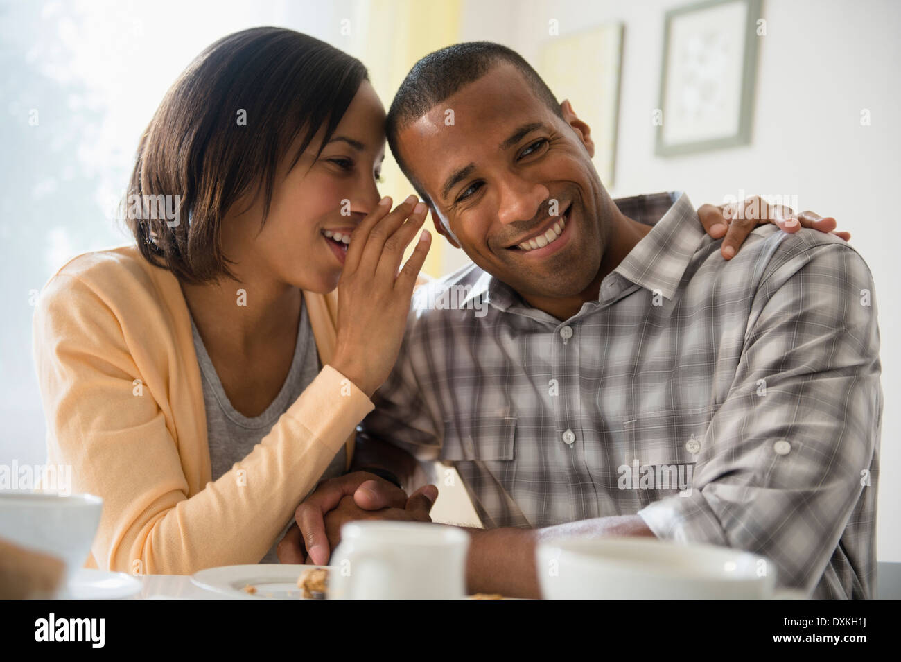 Young man whispering in hi-res stock photography and images - Alamy