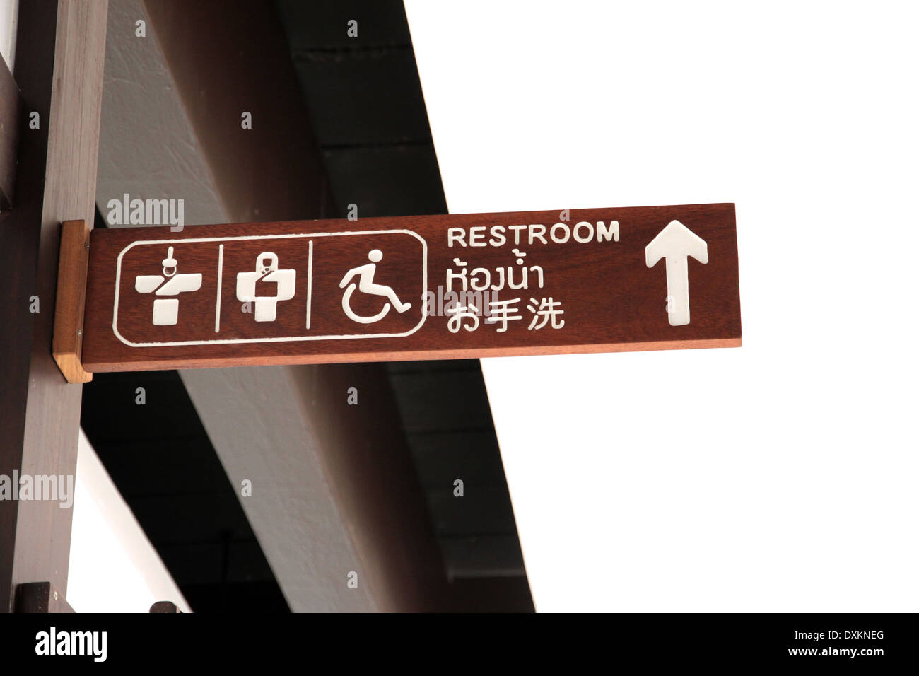 The Wooden sign pointing to the bathroom Stock Photo - Alamy