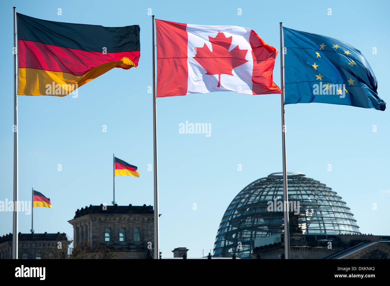 Berlin, Germany. 27th Mar, 2014. The flags of Germany and Canada flap ...