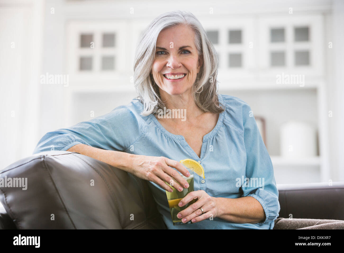 Portrait of smiling Caucasian woman drinking iced tea Stock Photo - Alamy
