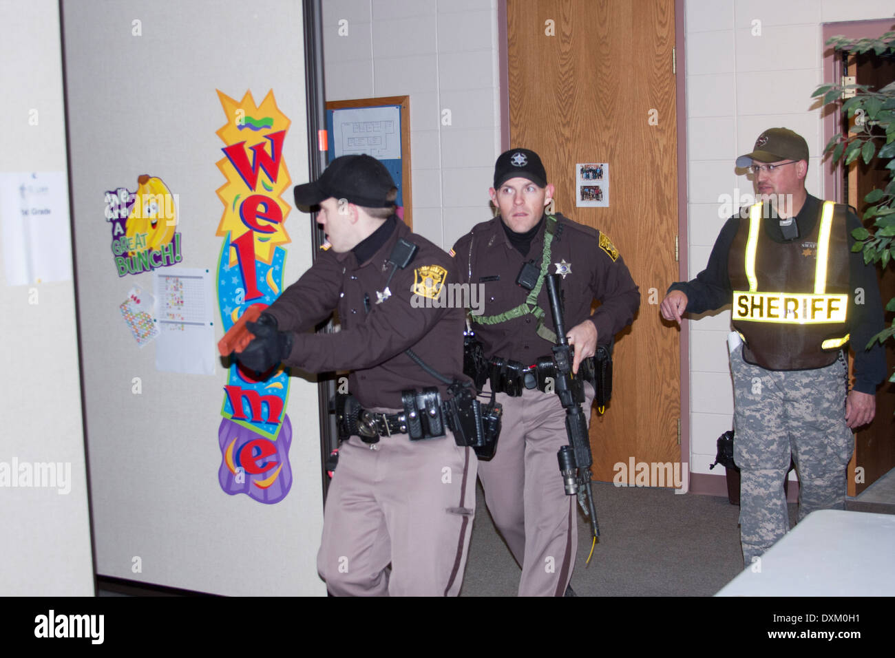 Sheriff personnel scanning rooms in a church for a shooter hiding ...