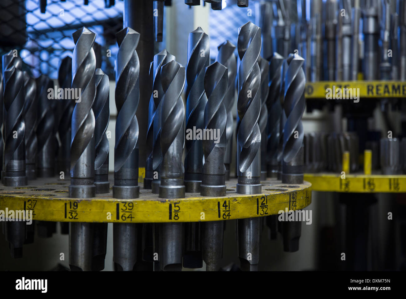 Various drill bits in metal shop Stock Photo - Alamy