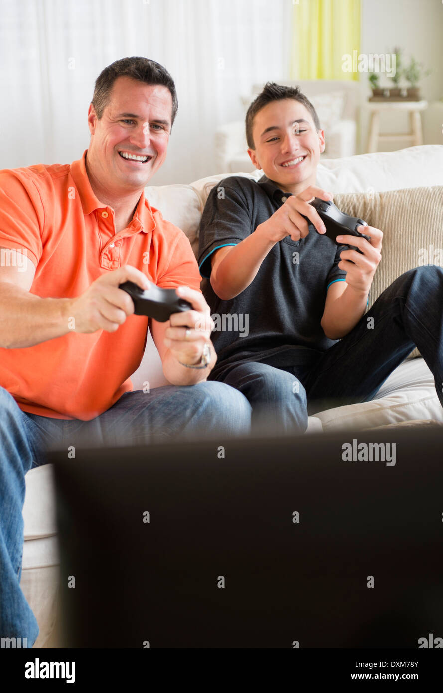 Father And Son Playing Video Games High Resolution Stock Photography ...