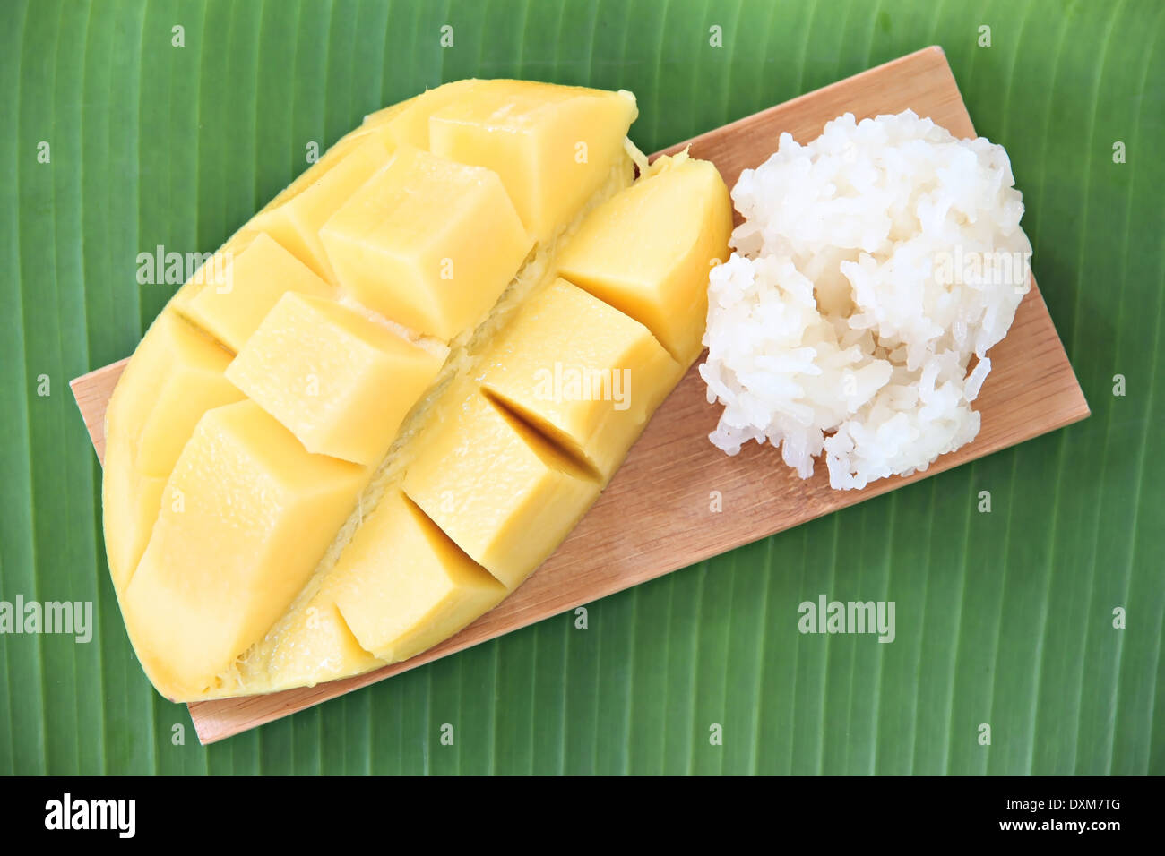Ripe mango and sticky rice in bamboo dish on banana leaves,local Thai ...