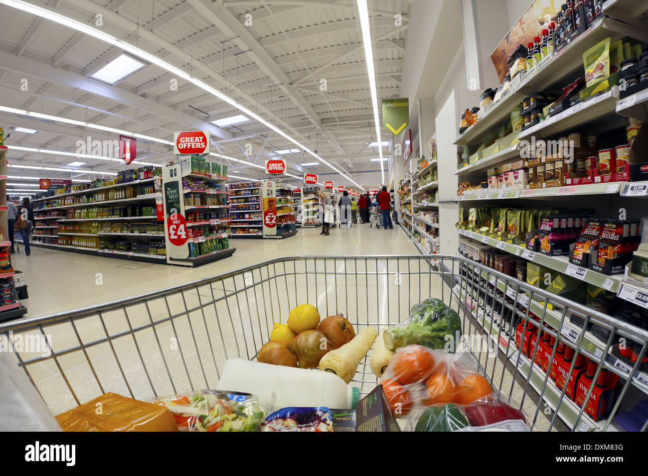 Interior of a supermarket with shopping trolley in foreground Stock ...