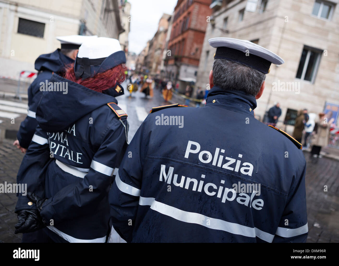 Italy, Rome, three policemen watching Carnival procession Stock Photo ...