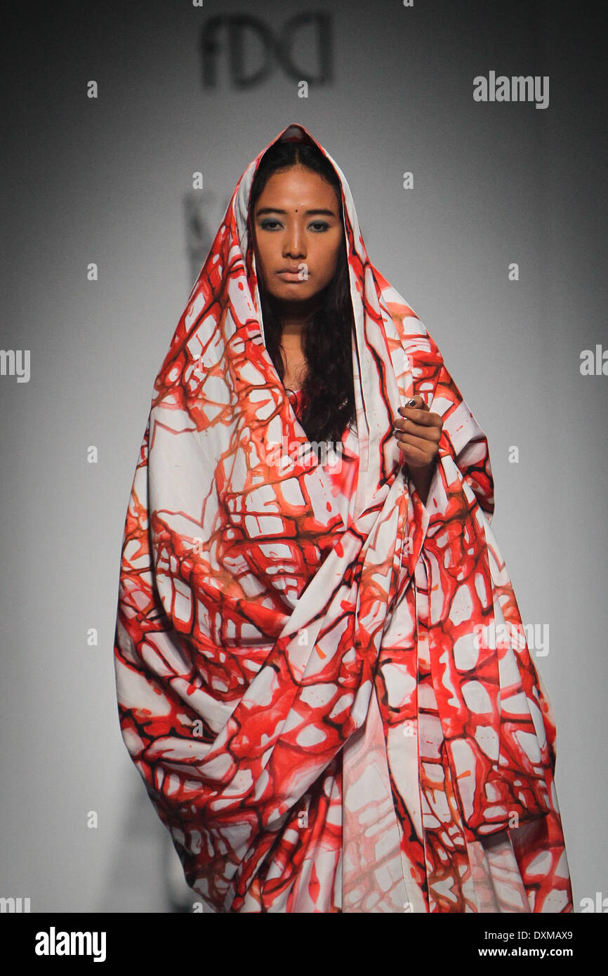 New Delhi, India. 27th Mar, 2014. A model presents a creation of Kallol ...