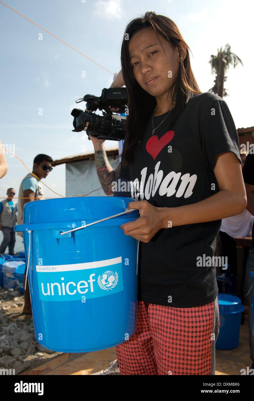 People get buckets from the aid organization Unicef in which are ...