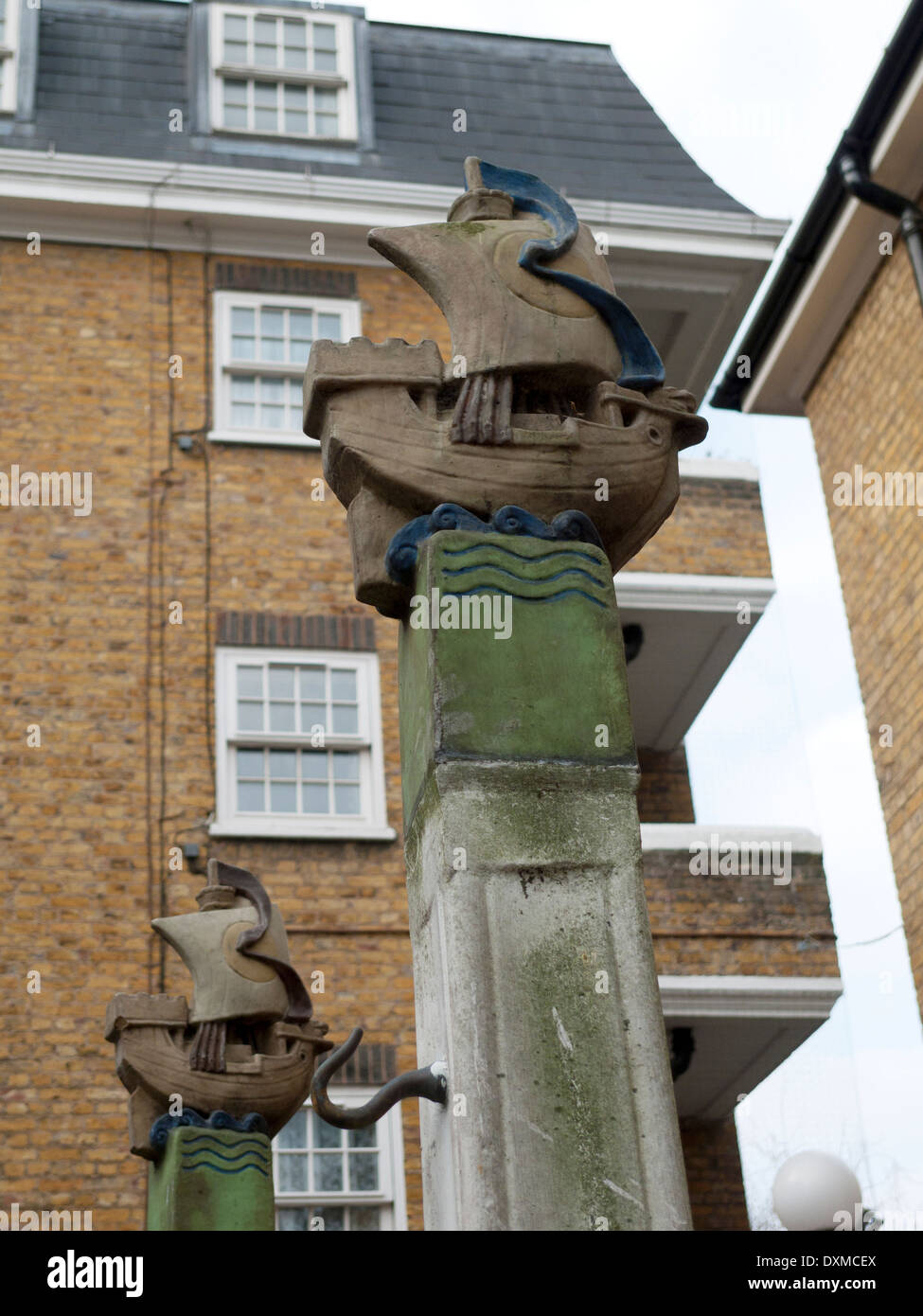 Replica ornamental finials on washing line posts designed by Gilbert ...