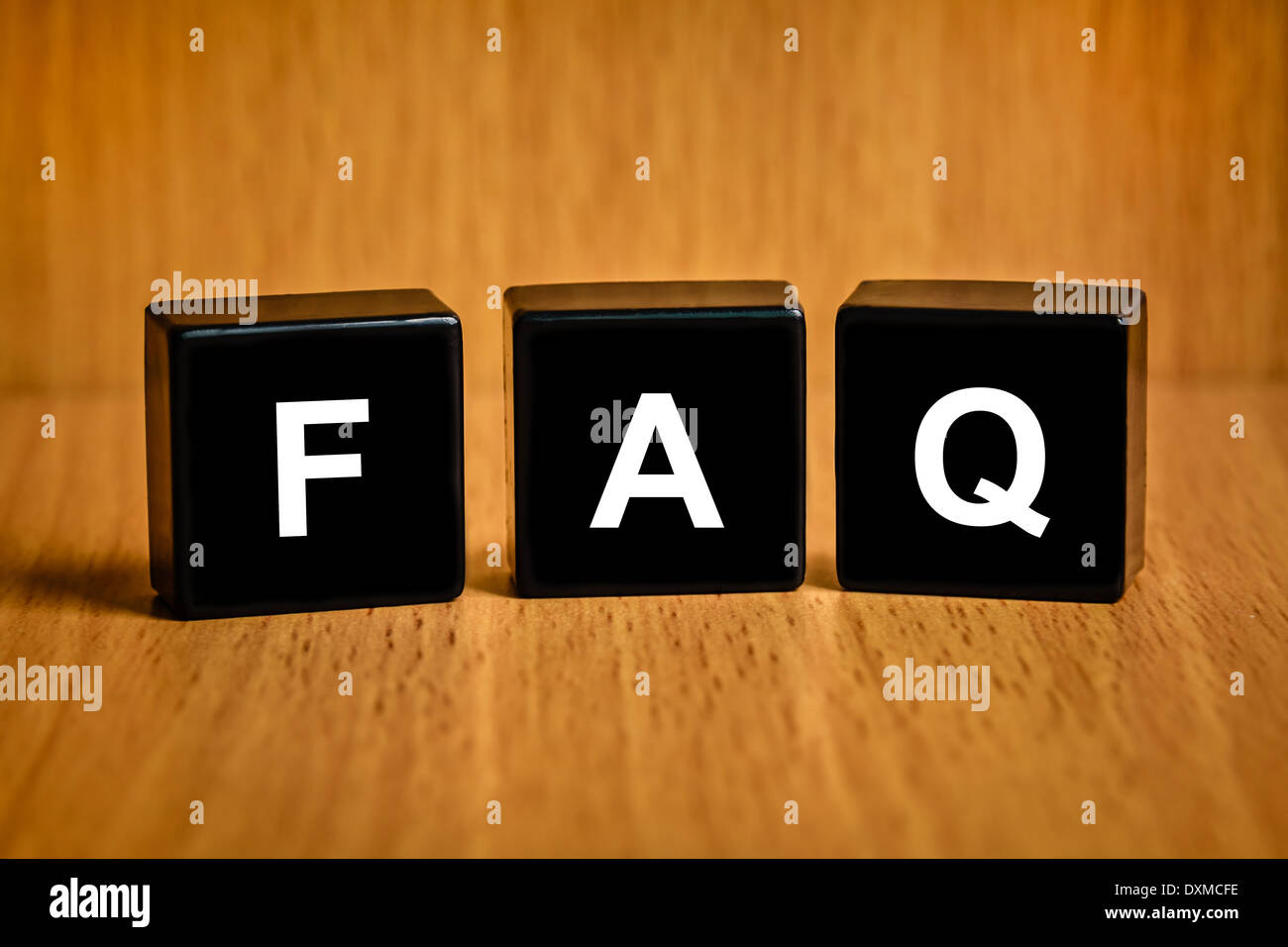 FAQ or Frequently asked questions text on black block Stock Photo - Alamy