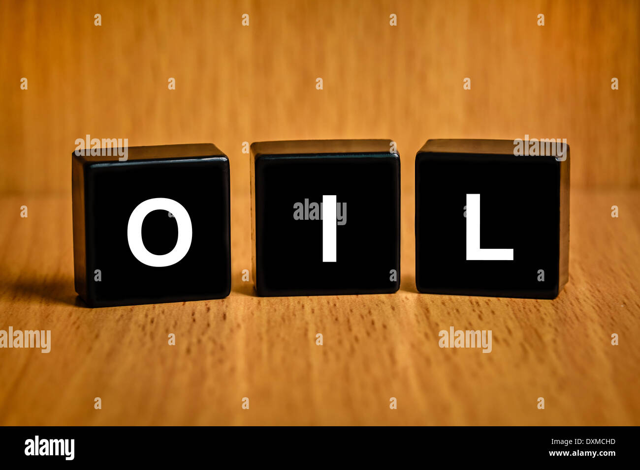 oil text on black block , business concept Stock Photo - Alamy