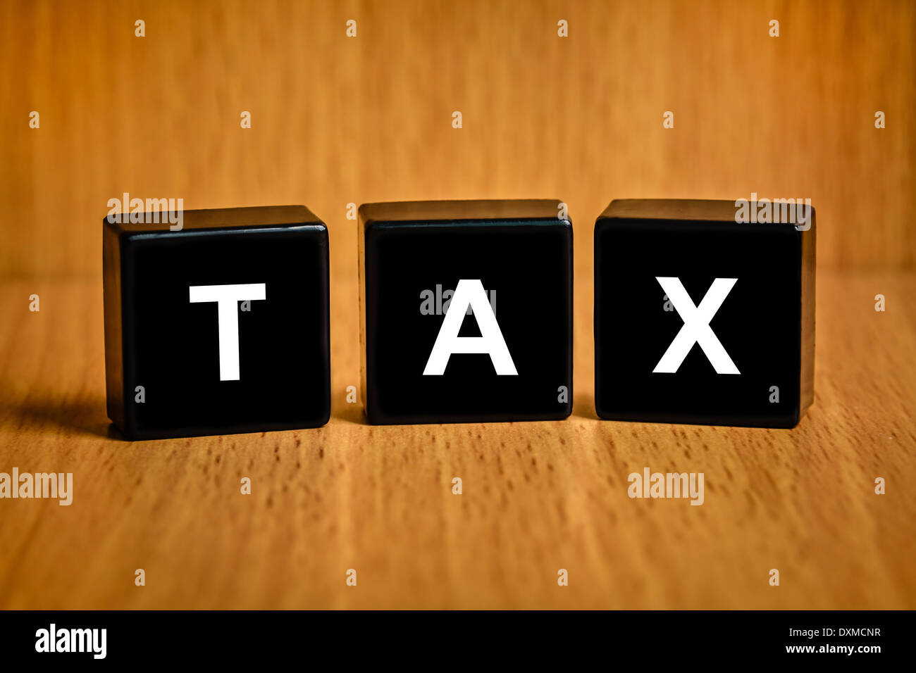 Tax accounting text on black block , business concept Stock Photo - Alamy