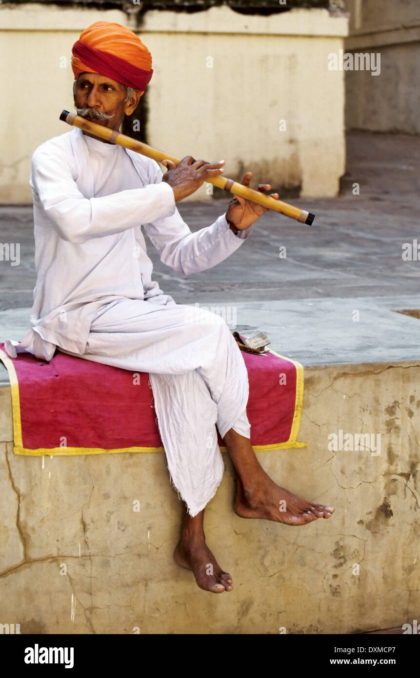 Indian man playing the flute hi-res stock photography and images - Alamy