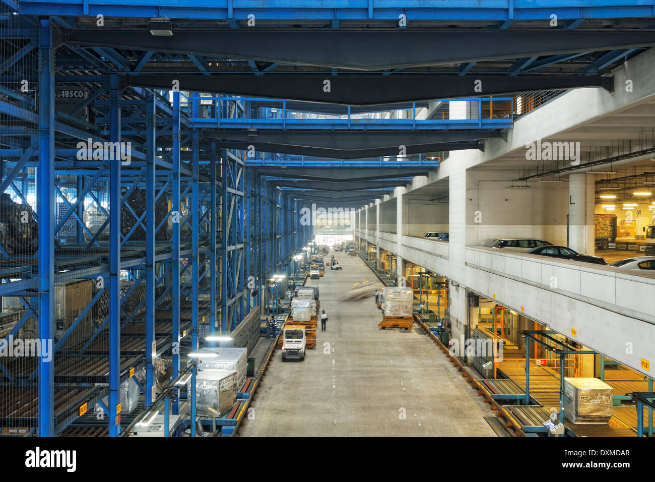 Rows of shelves with boxes in factory warehouse indoor Stock Photo - Alamy