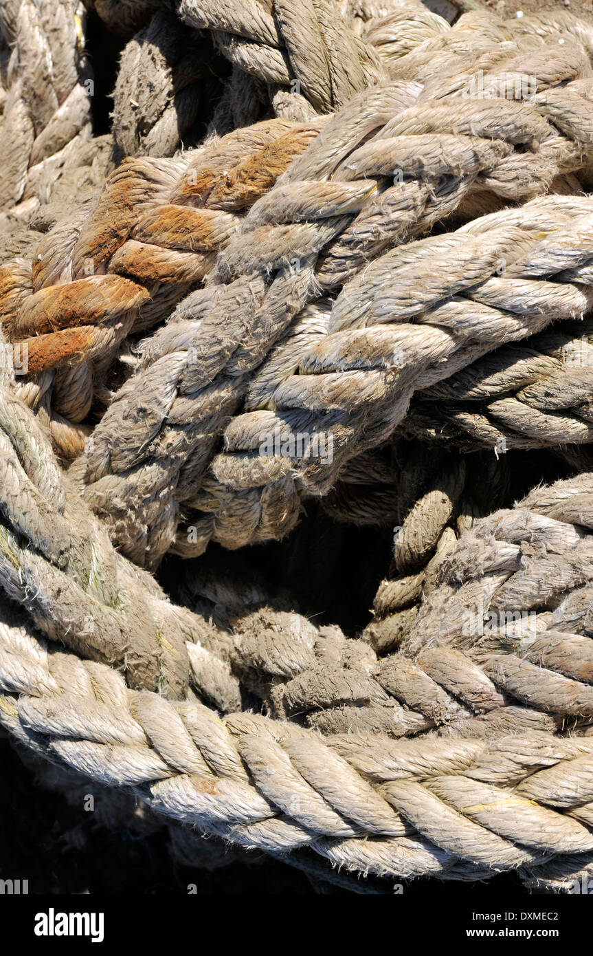 Old rope coiled around itself Stock Photo - Alamy