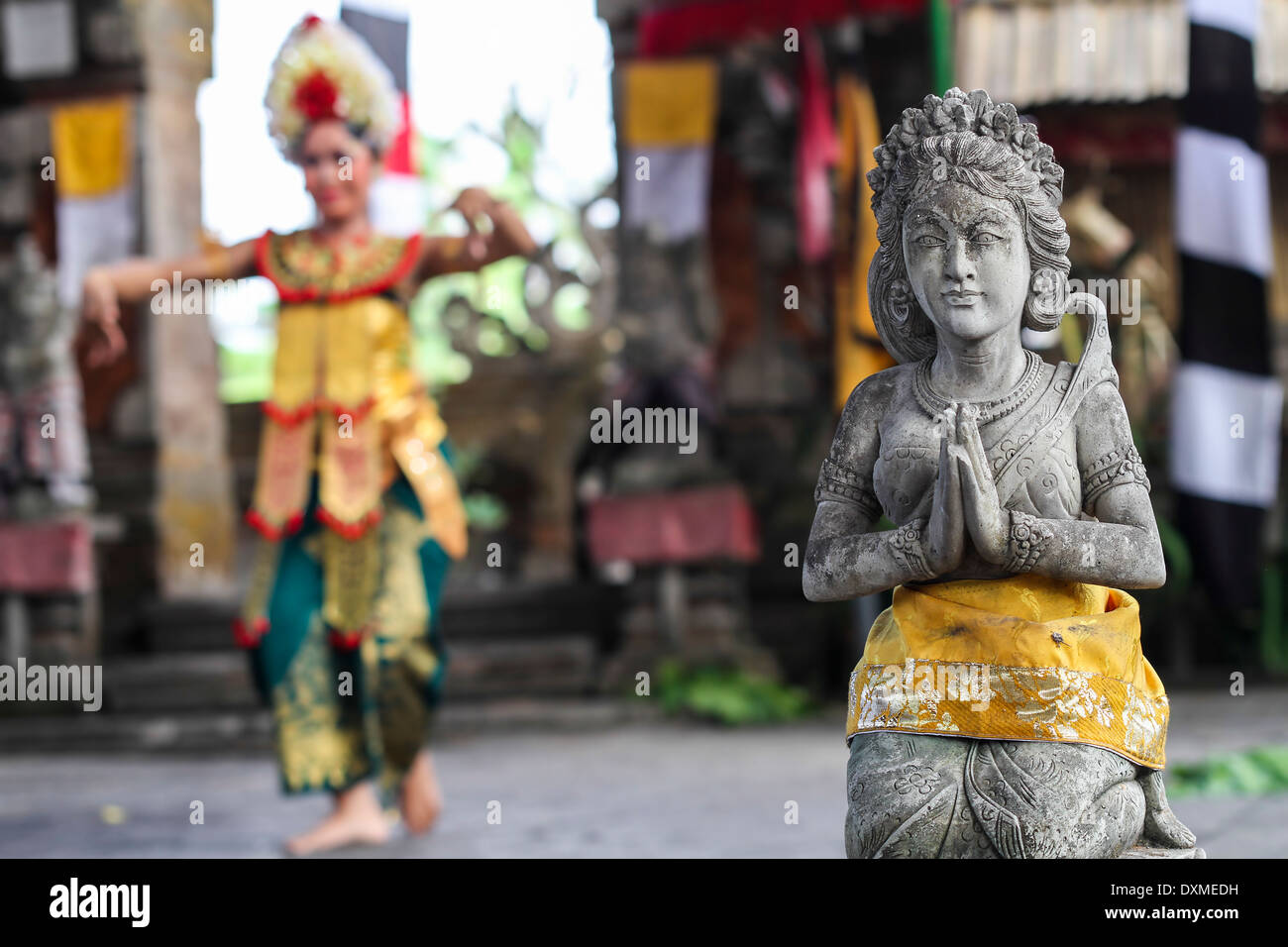Indonesia, Bali, Batubulan, view to statue, female dancer performing ...