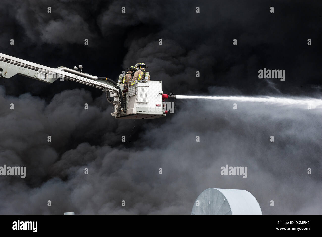 Toronto, CAN, 27 Mar 2014 - Thick, black, smoke blanketed the area ...