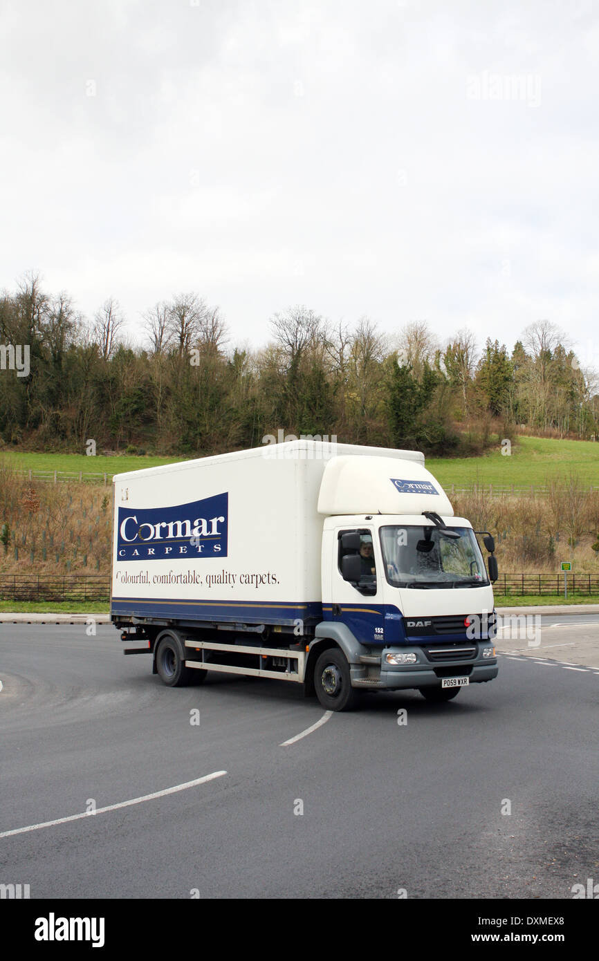 A Cormar Carpets truck traveling around a roundabout in Coulsdon ...
