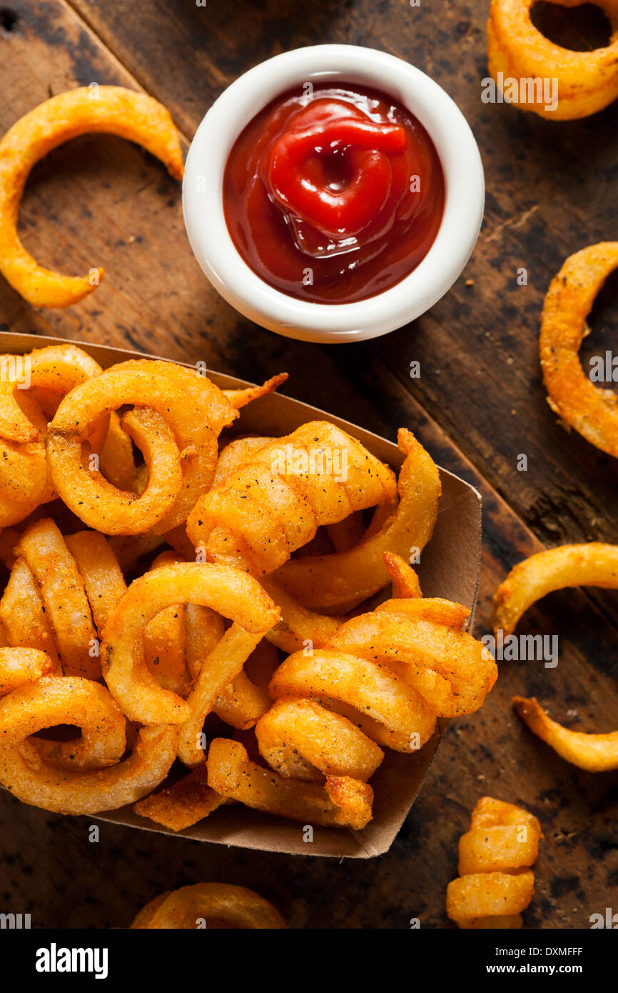 Spicy Seasoned Curly Fries Ready to Eat Stock Photo - Alamy