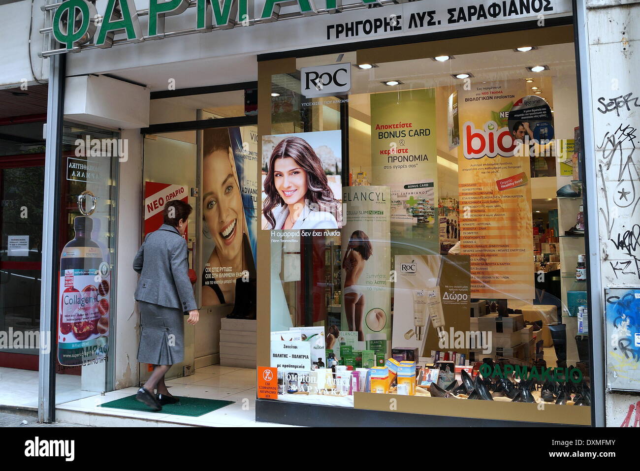 Woman enters shop in hi-res stock photography and images - Alamy