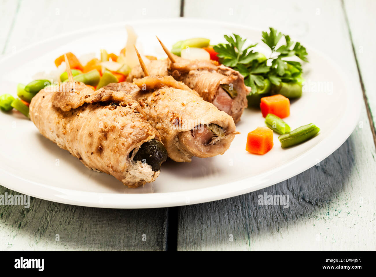 Beef rolls and vegetables on plate Stock Photo - Alamy