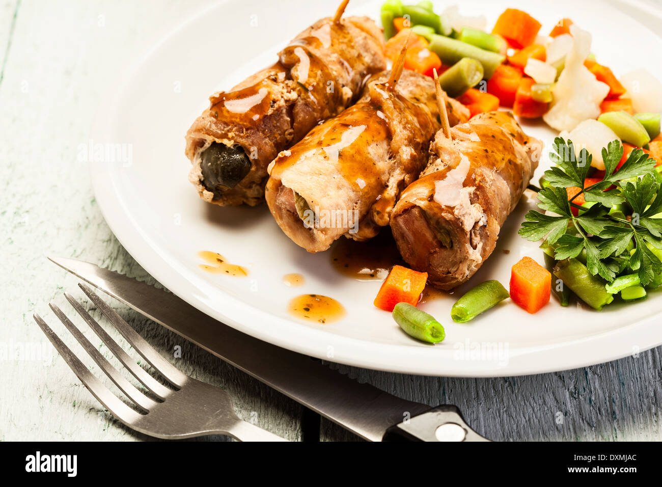 Beef rolls and vegetables on plate Stock Photo - Alamy