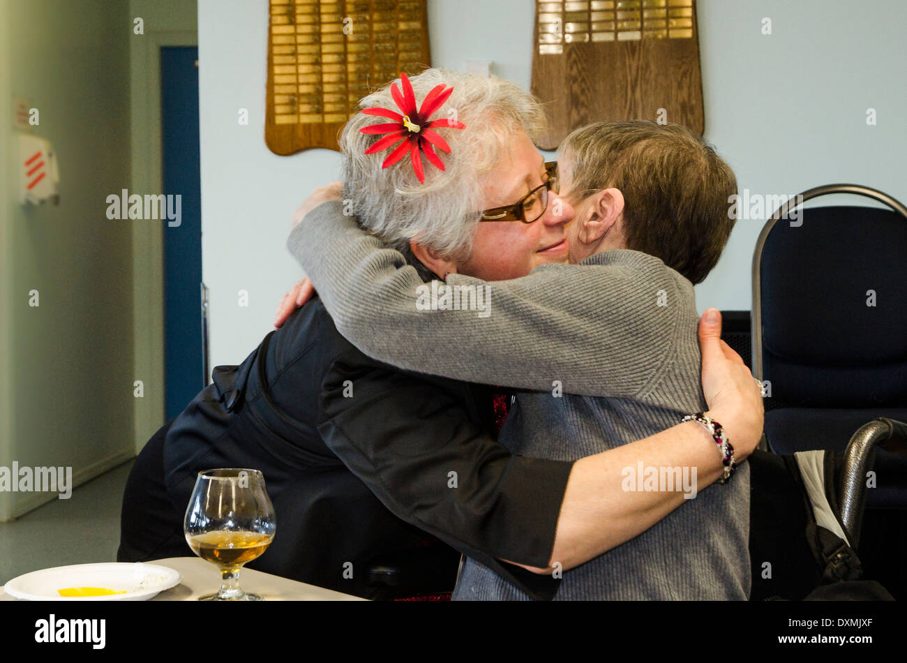 Widow comforted memorial hug consoles consoling friend woman hugging hi ...
