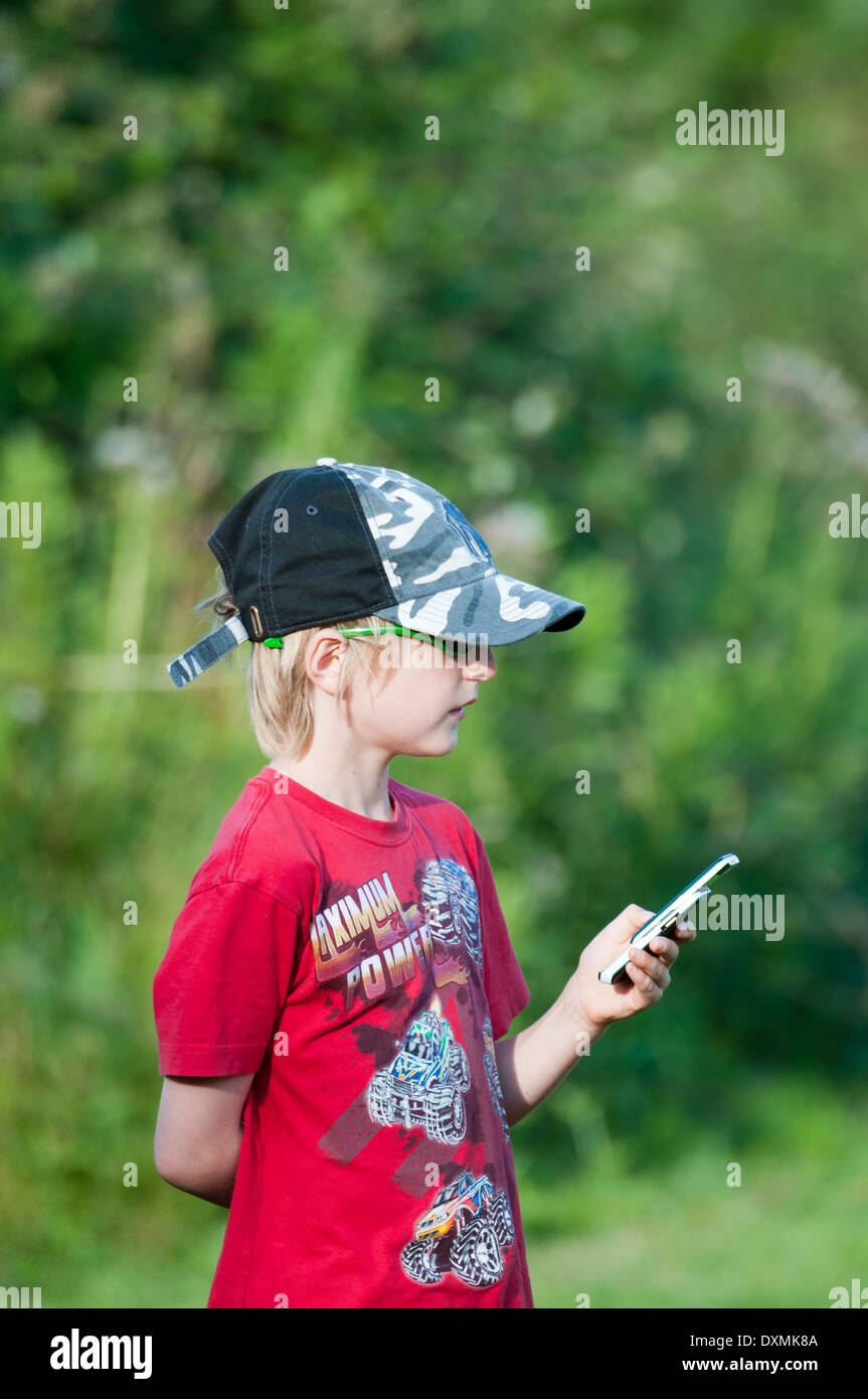 Boy child texting hi-res stock photography and images - Alamy