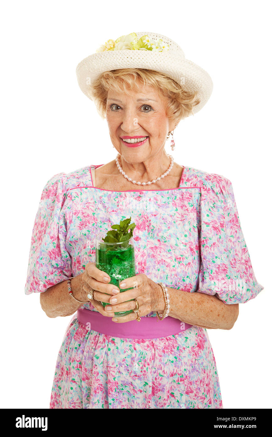 Beautiful senior Southern Belle drinking a traditional mint julep to ...